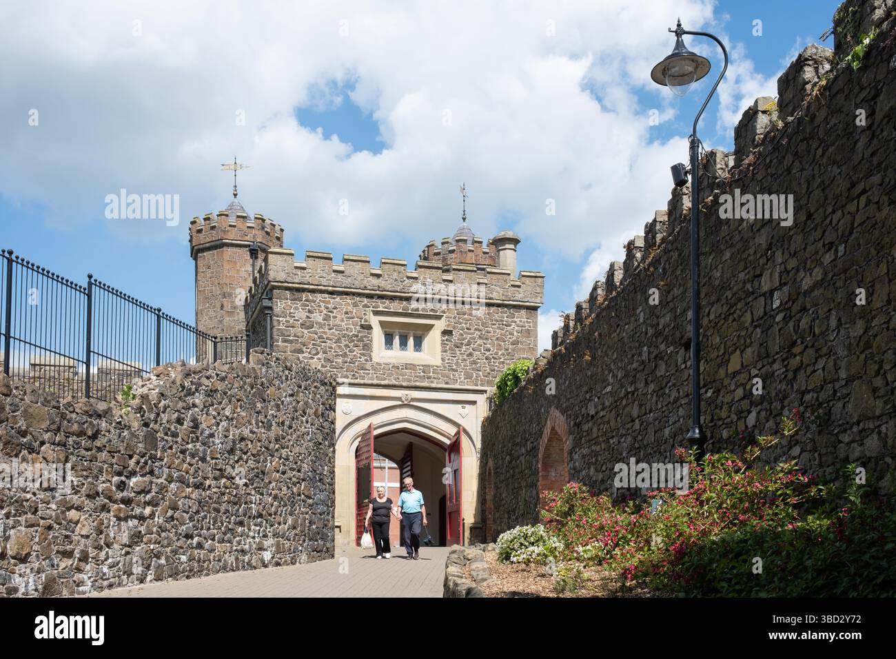 Antrim, Northern Ireland - May 20th, 2025: A couple walking on a bright ...