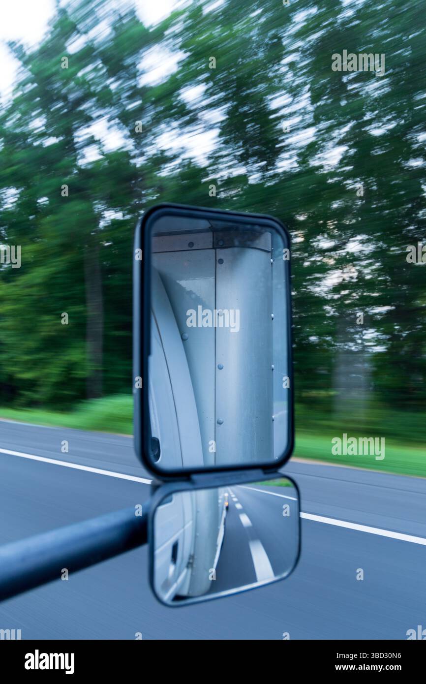Car side mirror reflecting an empty road ahead hi-res stock photography ...