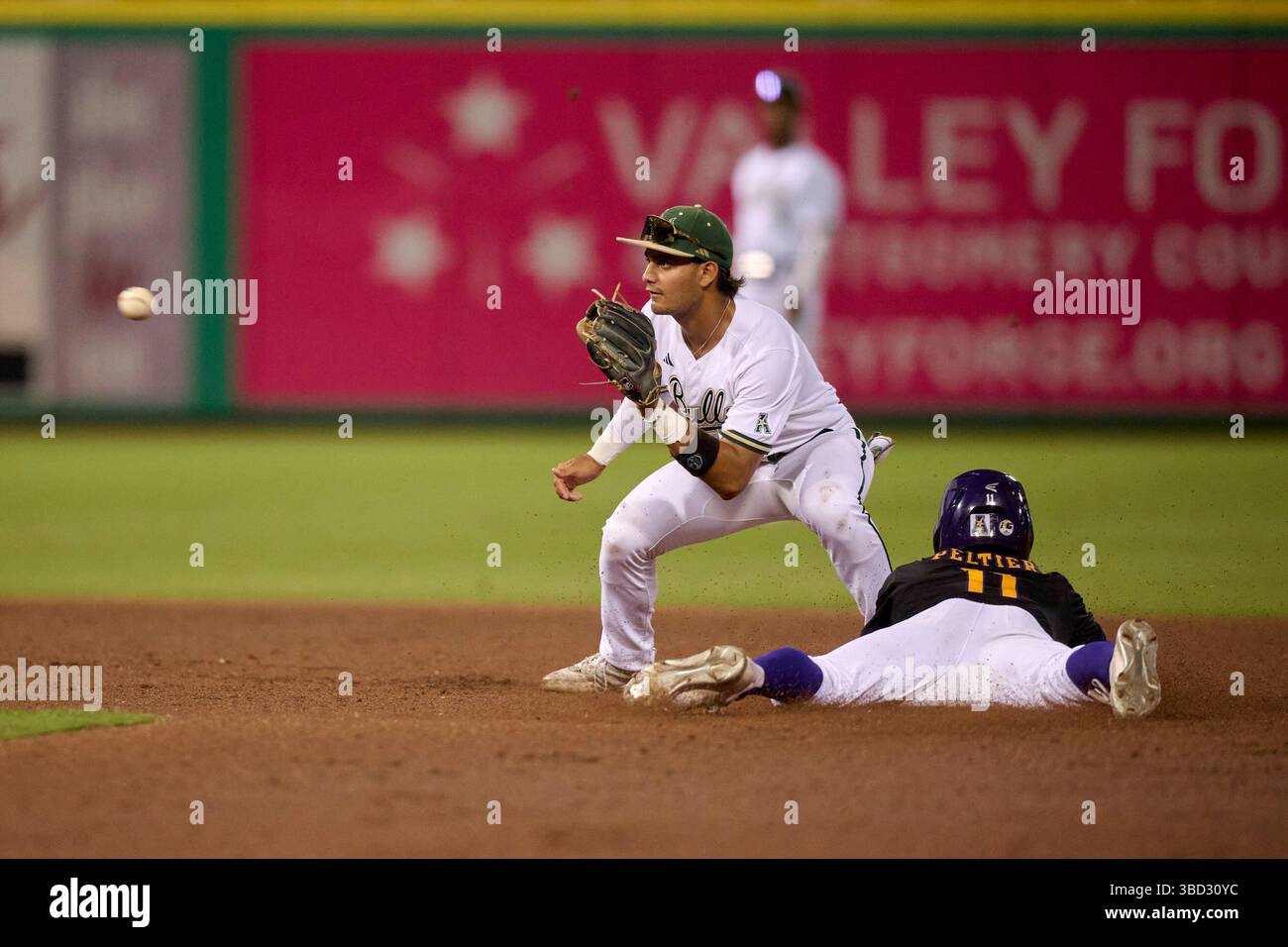 USF Bulls second baseman Carlos Jacome (17) fields a throw as Alex ...