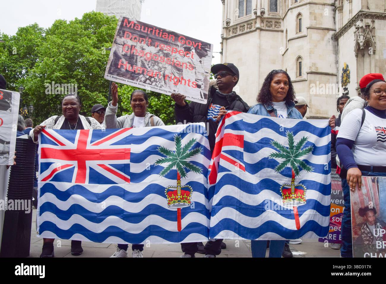 London, UK. 22nd May 2025. Members of the Chagossian community gather outside the Royal Courts ...