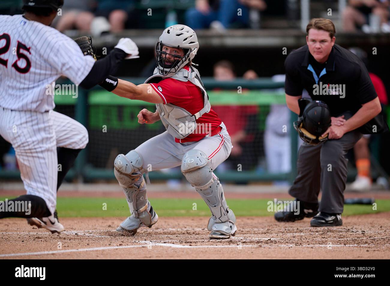 Chattanooga Lookouts catcher Michael Trautwein (23) looks to tag DJ ...