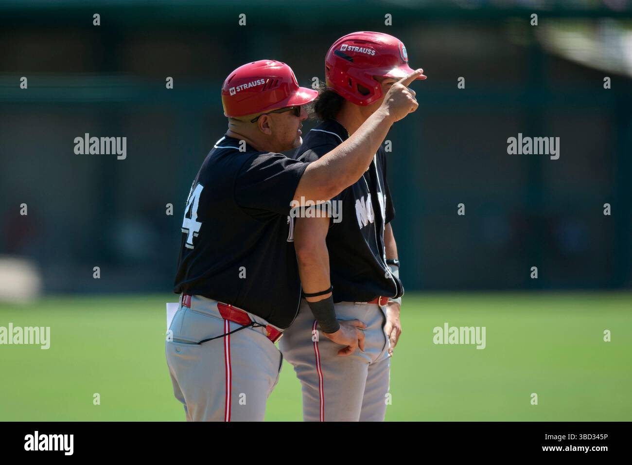 Chattanooga Lookouts manager Jose Moreno (24) talks with Edwin Arroyo ...