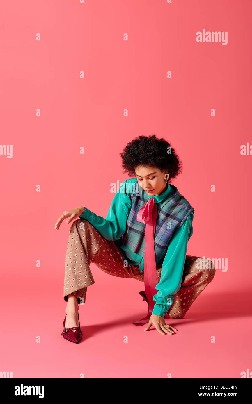 A stylish young woman poses gracefully, wearing a colorful ensemble and ...