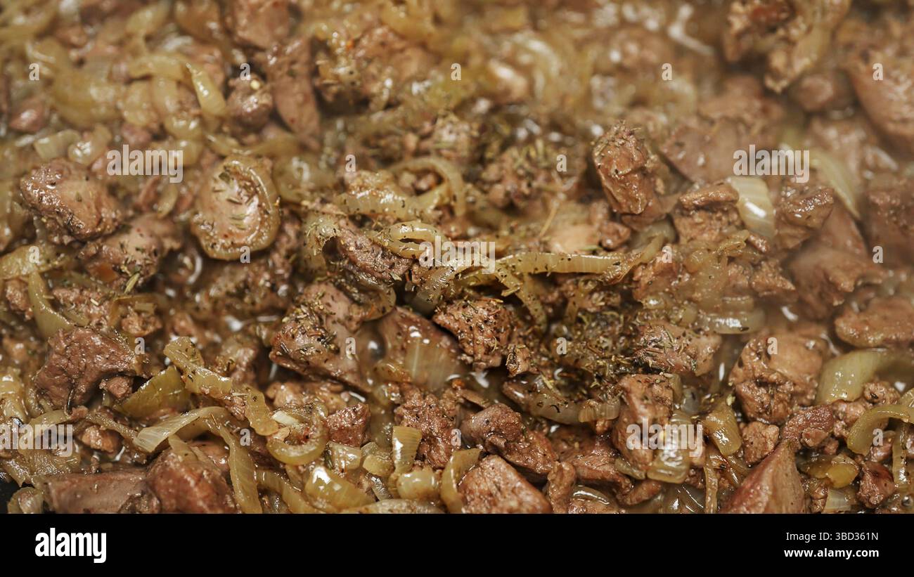 Frying Chicken Liver with Onions in Hot Skillet Stock Photo - Alamy