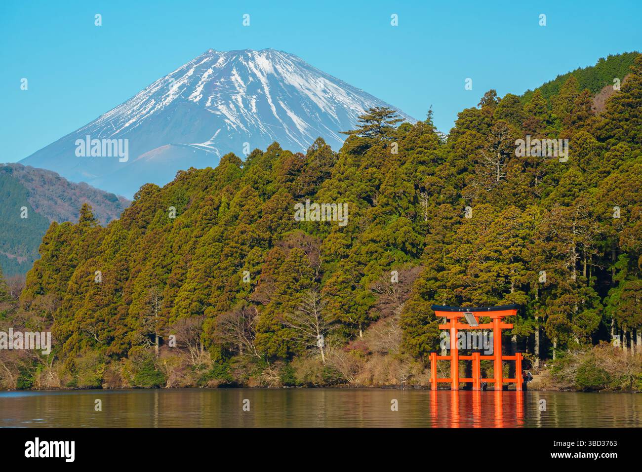 Peaceful morning scene in Hakone, Japan, featuring Lake Ashi, a red ...
