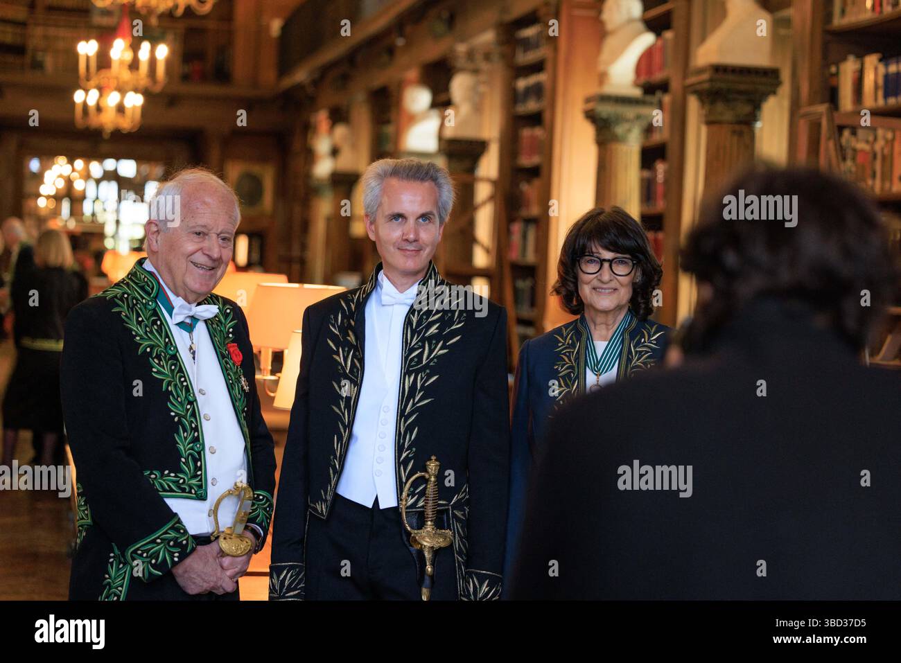 French professor of psychiatry Raphazl Gaillard poses, flanked by ...