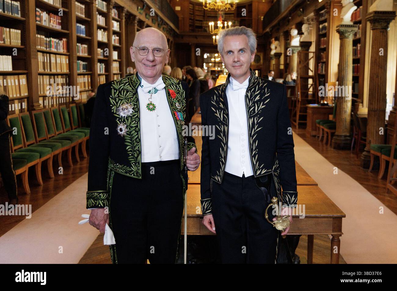 French professor of psychiatry Raphazl Gaillard poses, flanked by ...