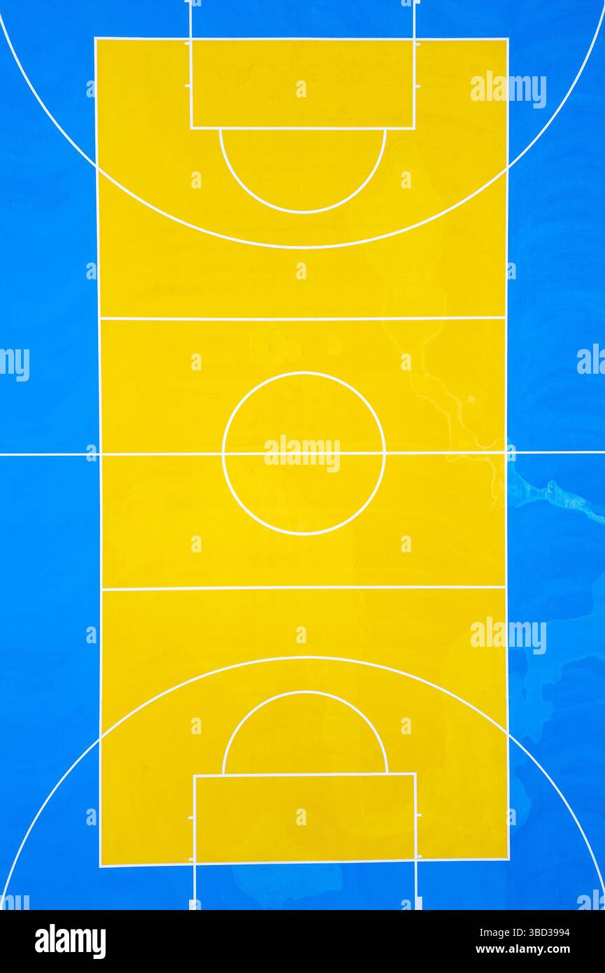 Aerial view of a colorful outdoor basketball court with vibrant blue ...
