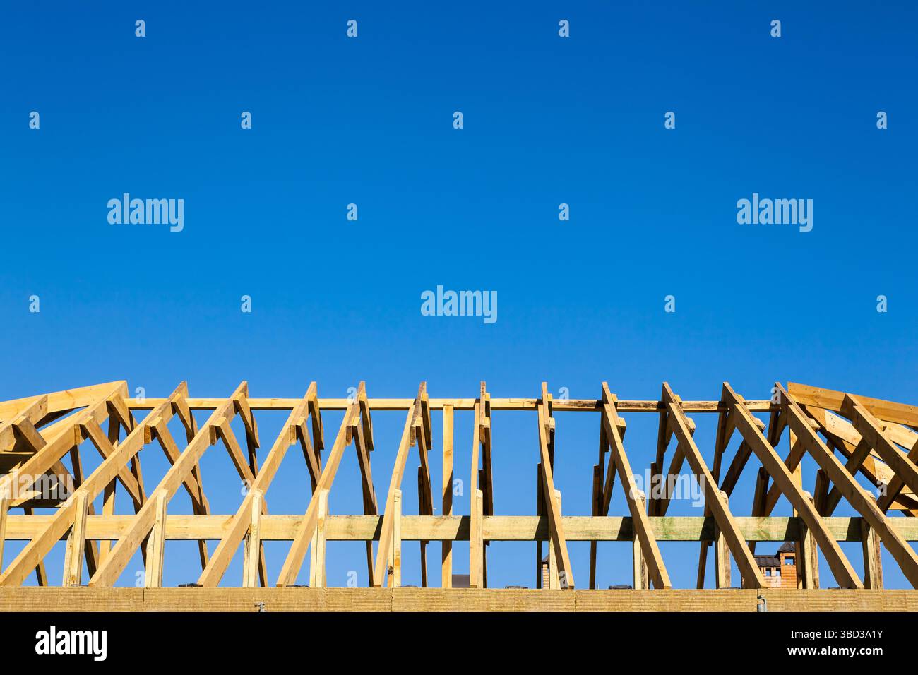 Construction of the roof of a new private house. New wooden beams ...