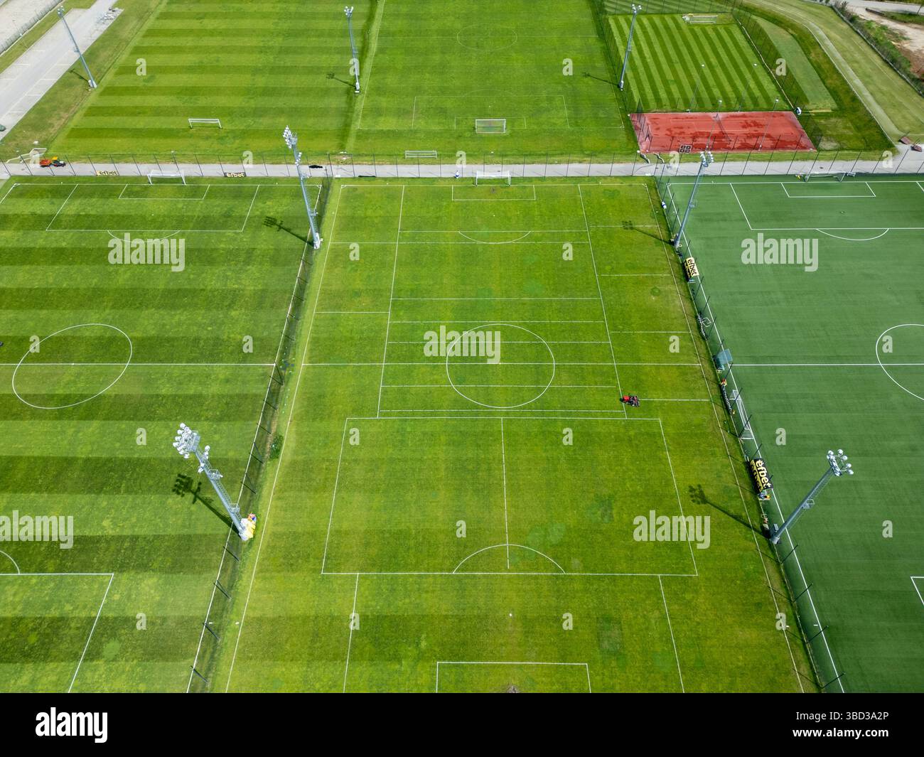 Aerial view of multiple football fields in a sports complex. Some have ...