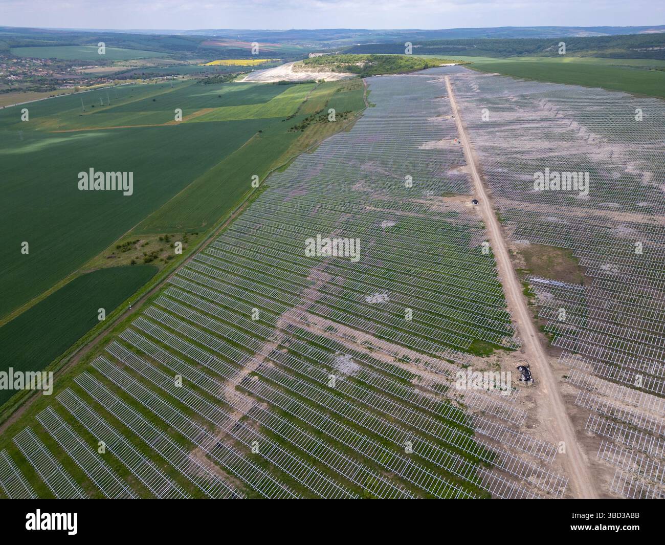 Aerial view of a solar farm under construction with metal mounting ...