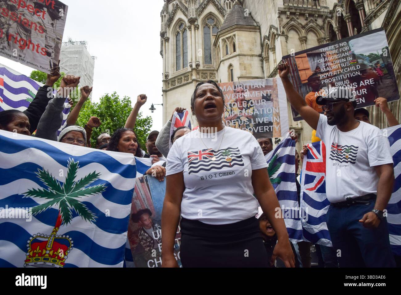 London, UK. 22nd May 2025. Members of the Chagossian community gather outside the Royal Courts ...