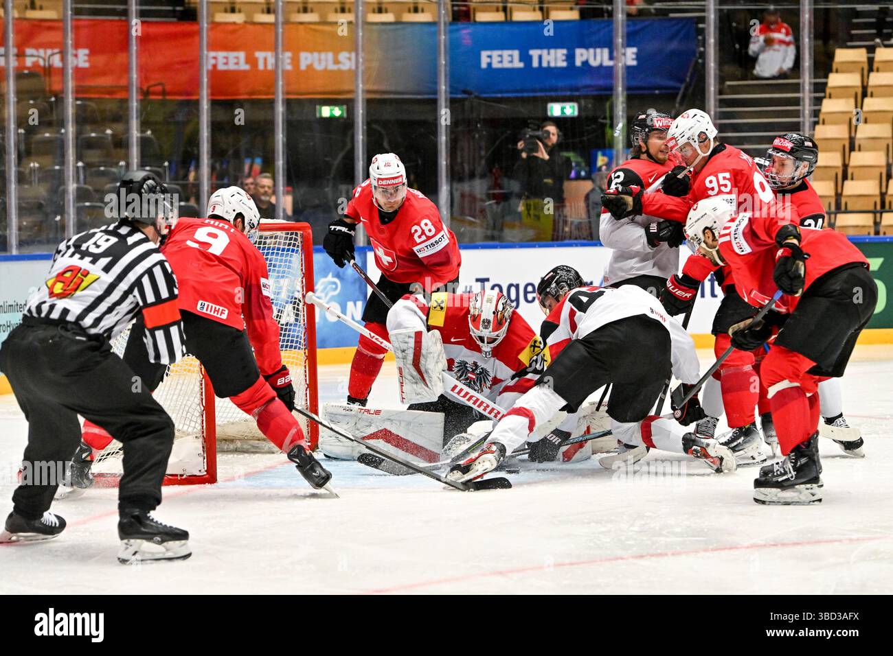 ODENSE, DENMARK - MAY 22: A battle for the puck in front of goalkeeper ...