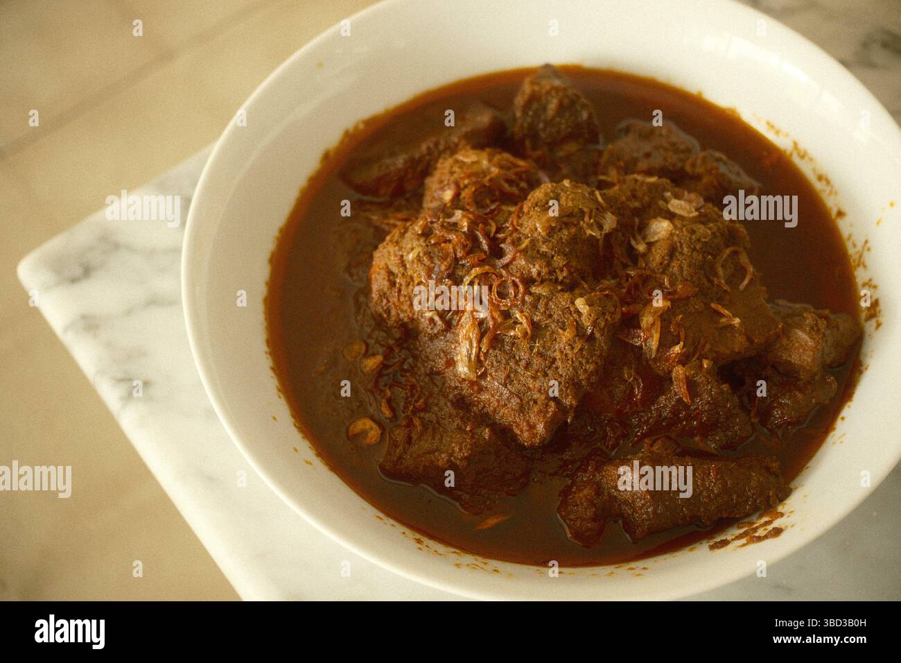 Traditional Indonesian dish rendang is made of beef slowly cooked with ...