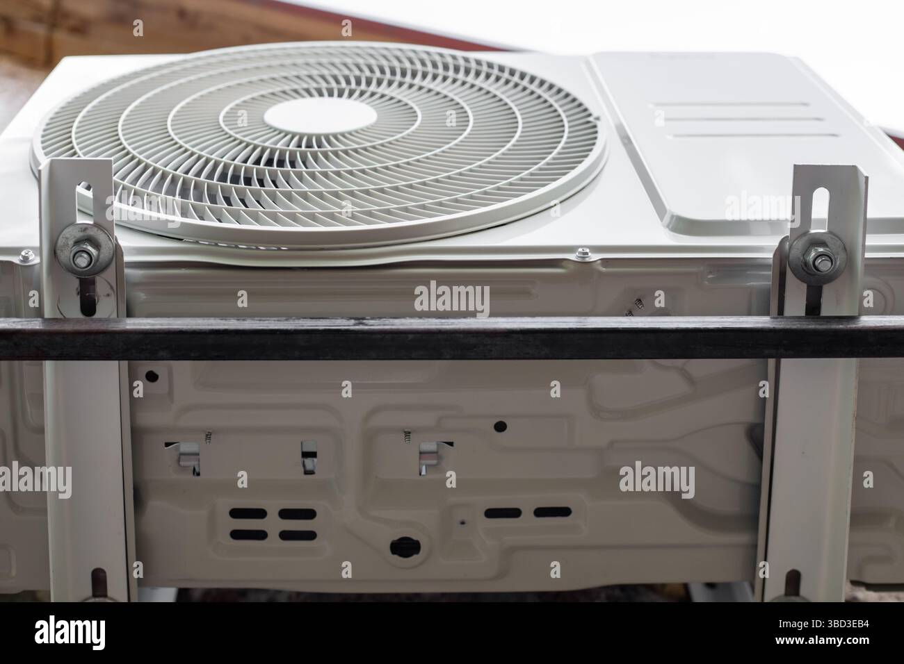 The outdoor unit of the air conditioner is fixed with bolts to brackets ...