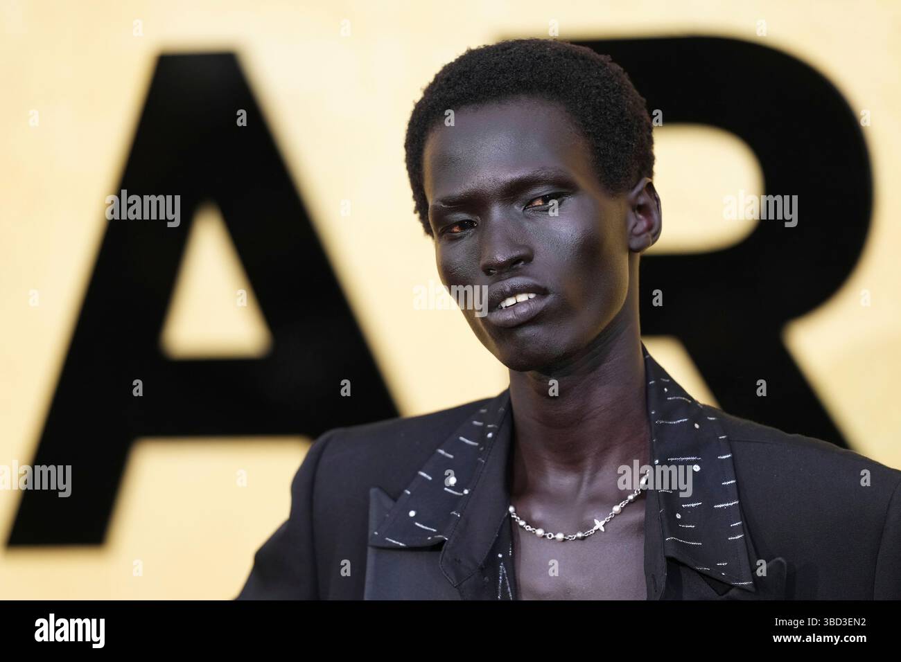 Mamuor Majeng poses for photographers upon arrival at the amfAR Cinema ...