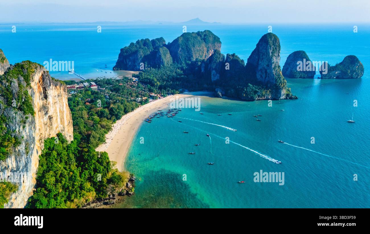 Railay Beach in Krabi Thailand showcases breathtaking limestone cliffs ...