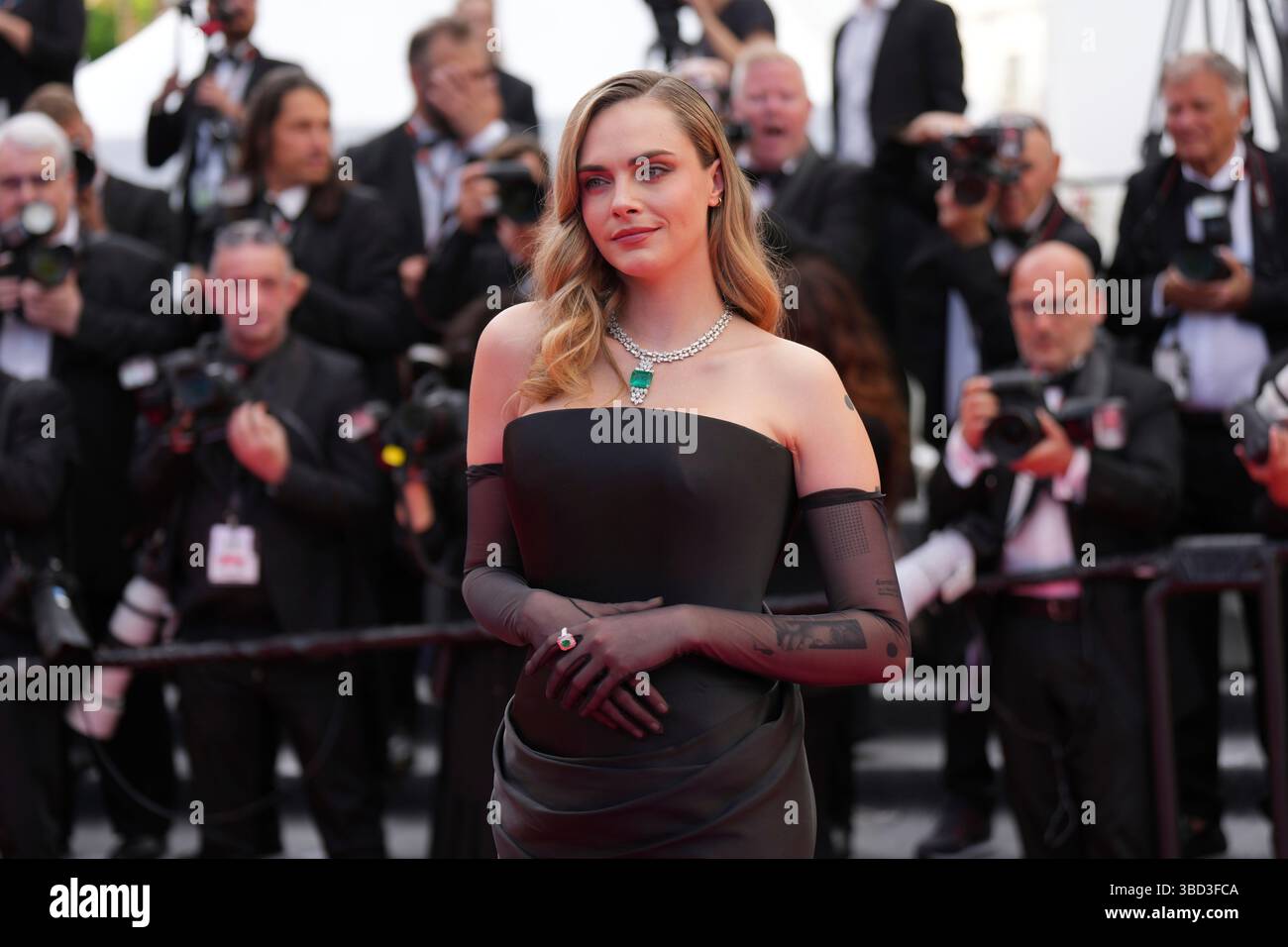 Cara Delevingne poses for photographers upon arrival at the premiere of ...
