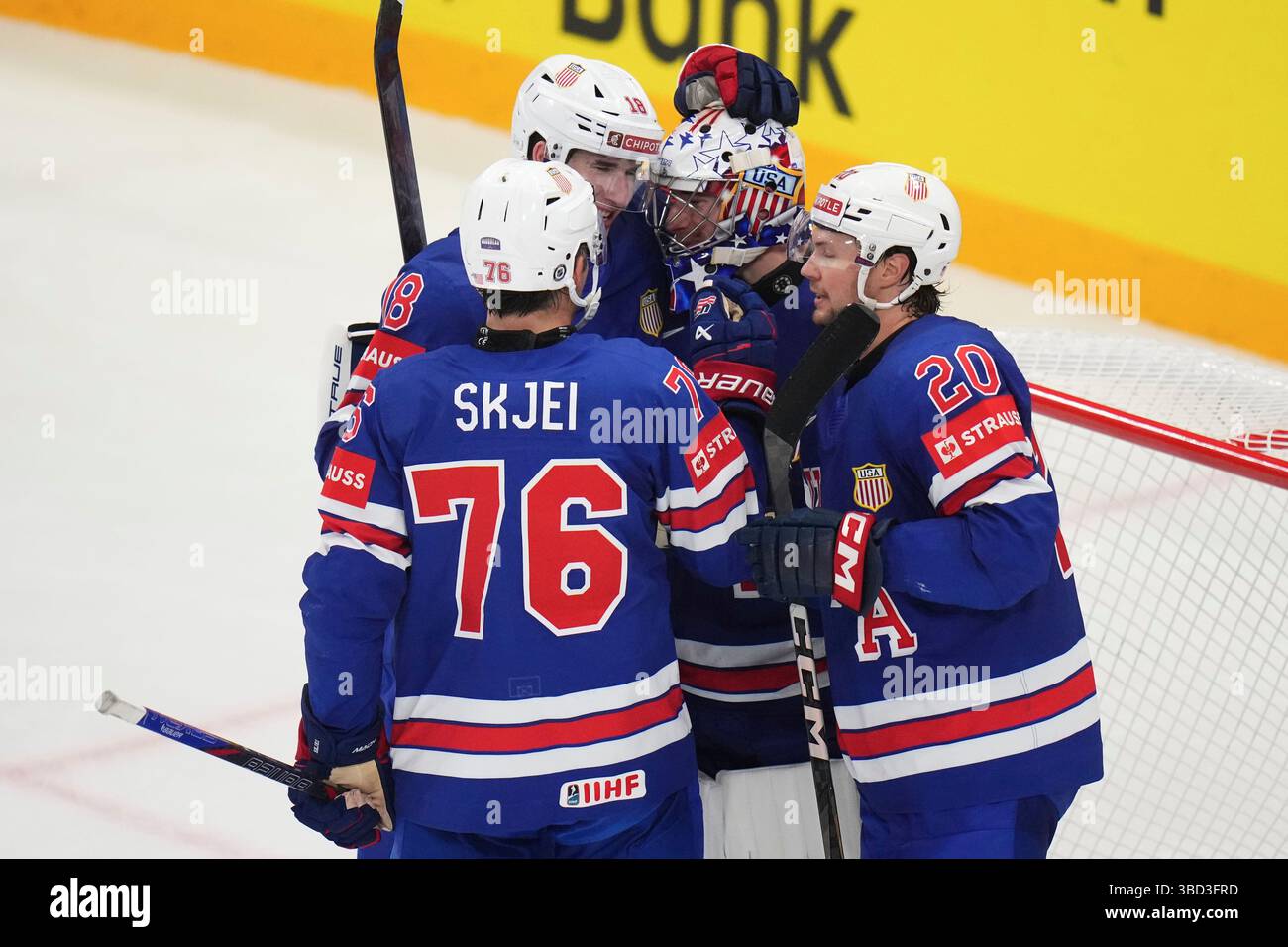 The United States' Drew O'Connor (18) celebrates with Jeremy Swayman ...