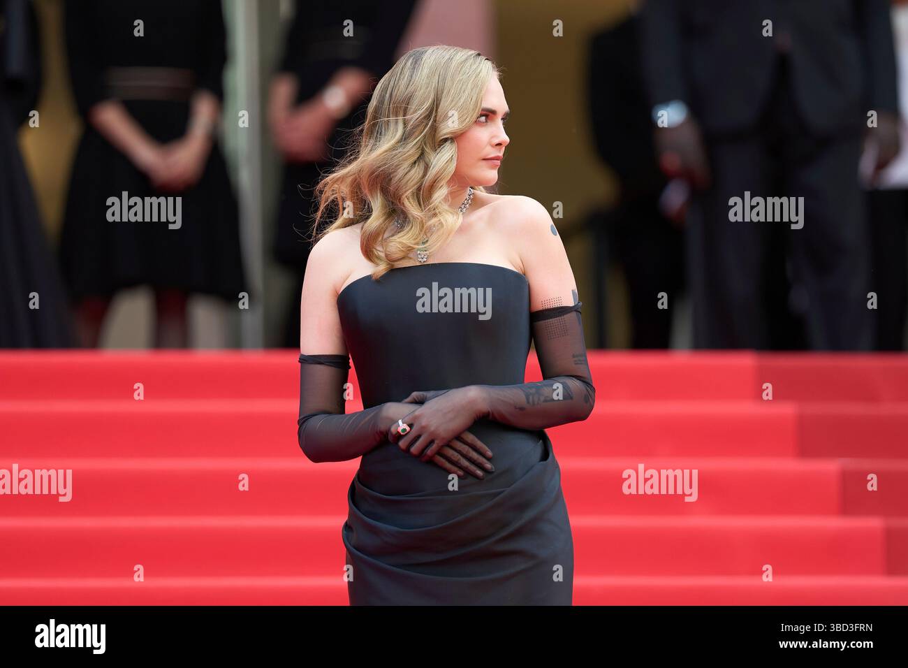 Cara Delevingne poses for photographers upon arrival at the premiere of ...
