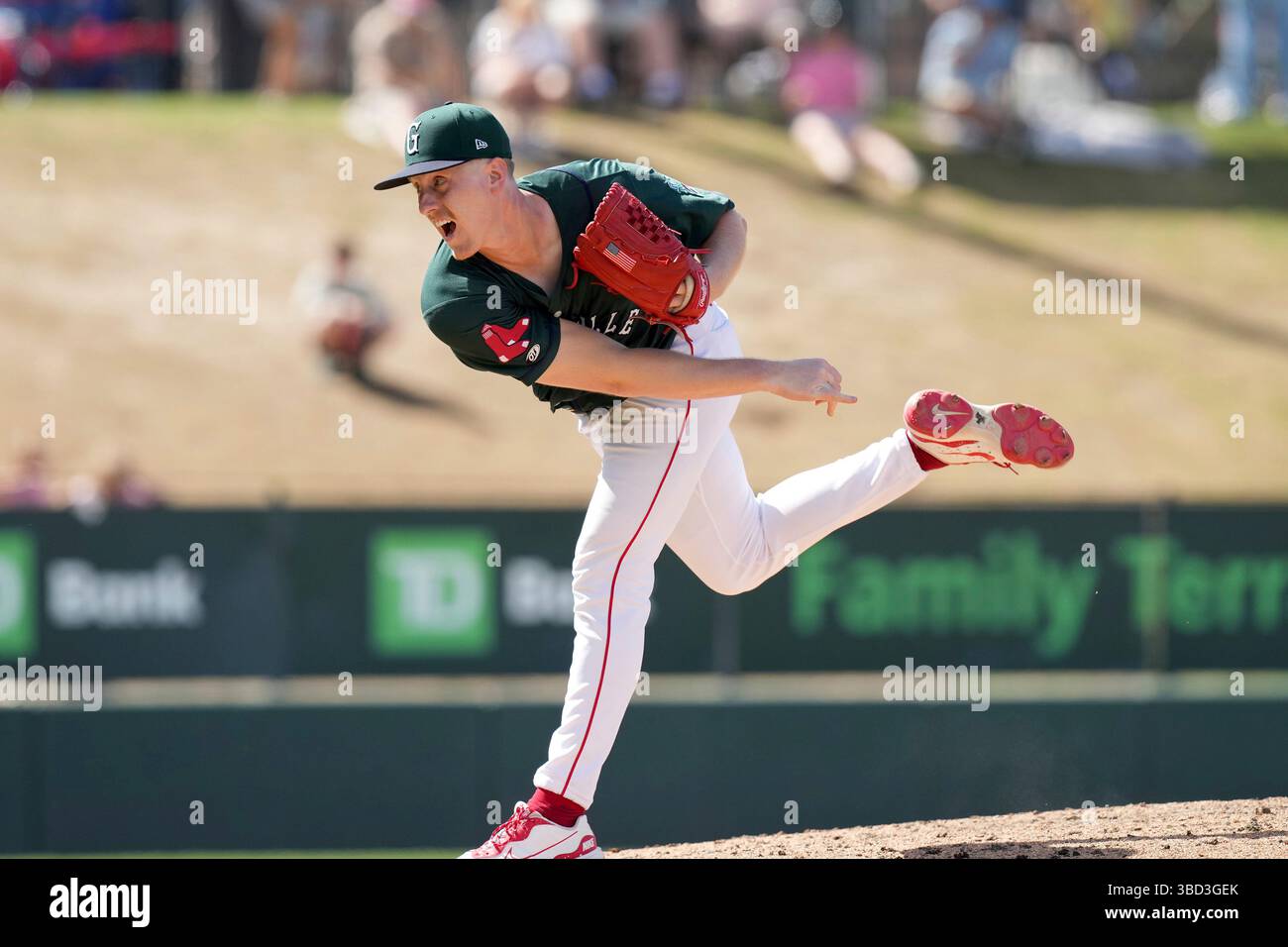 Relief pitcher Max Carlson (33) of the Greenville Drive delivers a ...