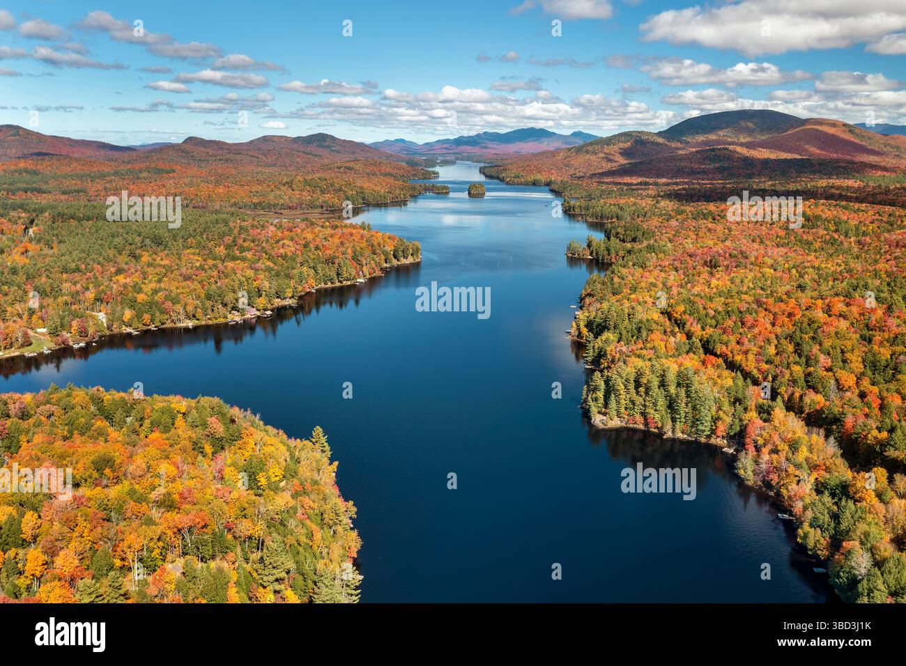 Aerial view of 14 mile long Long Lake in Adirondack Park during the ...