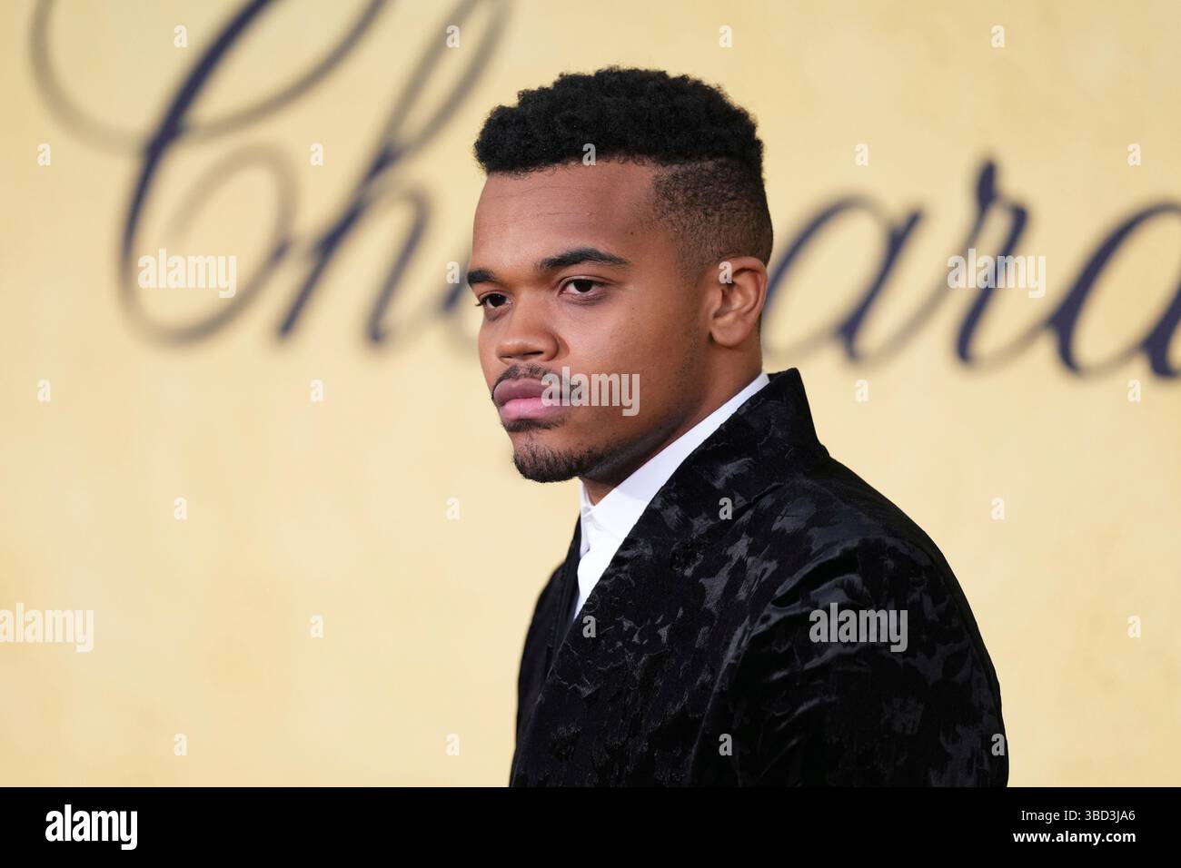 Elijah Wright poses for photographers upon arrival at the amfAR Cinema ...