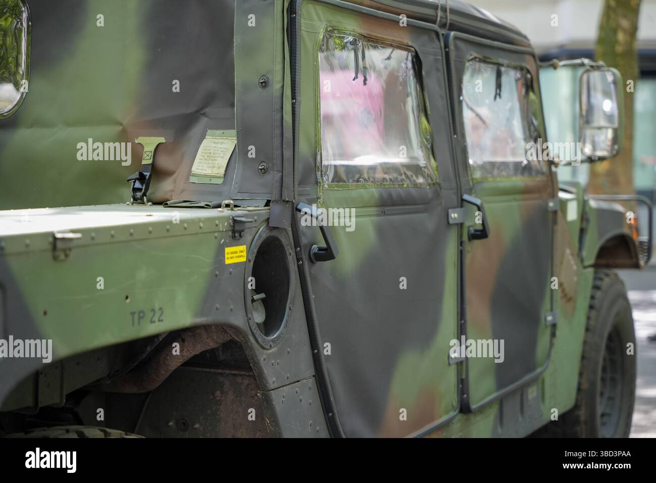 Germany Berlin May 11, 2025. Camouflaged Military Vehicle. A military ...