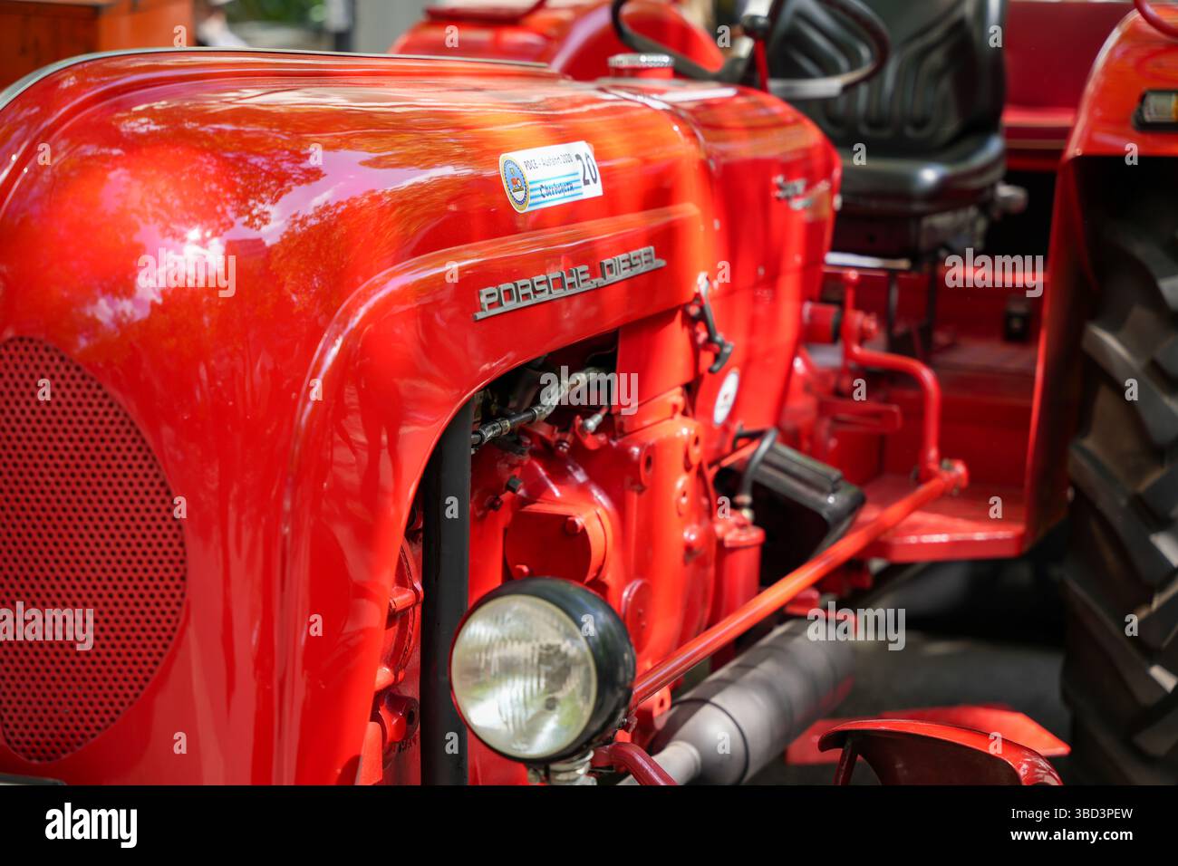 Germany Berlin May 11, 2025. Porsche diesel tractor side view. A red ...
