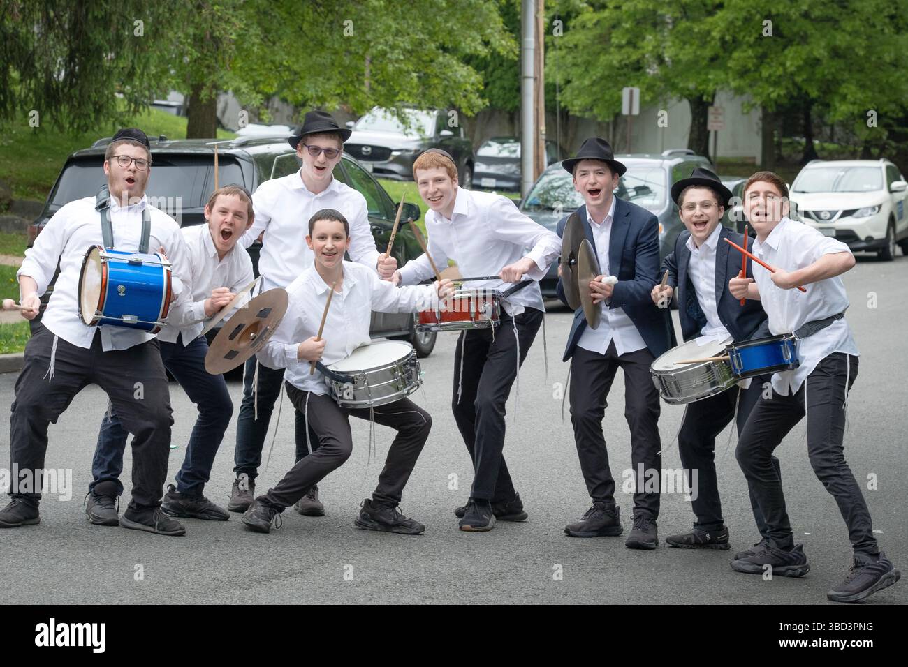 Group photo of 8 hasidic Jewish percussionists preparing to perform in ...