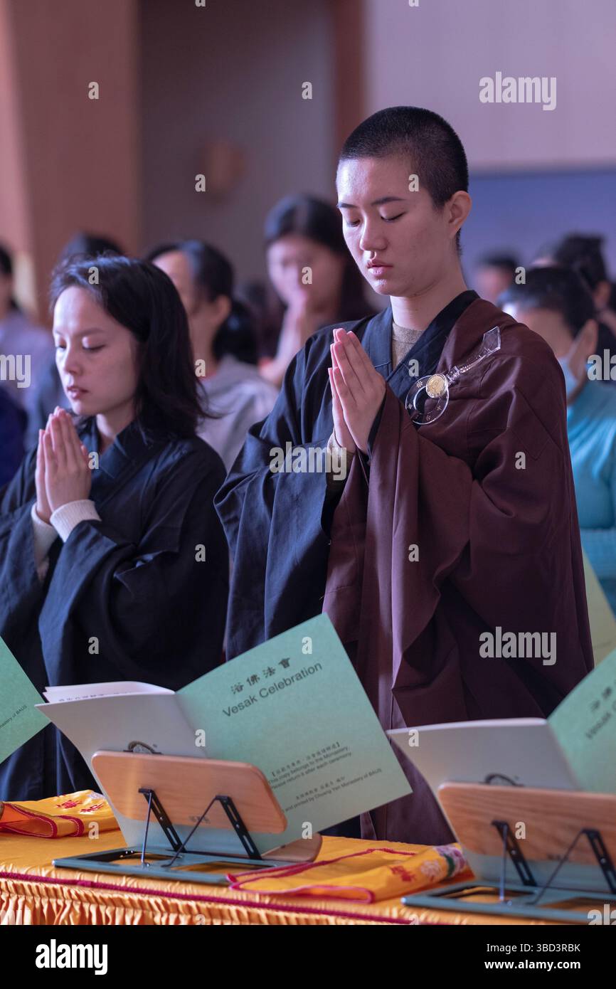 Pretty Asian American nusn meditates during Vasek celebration of the ...