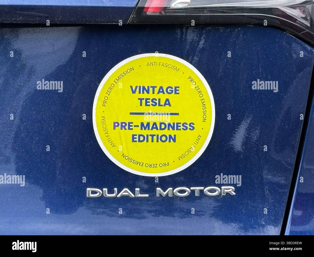 A bumper sticker on a Tesla car bought before Elon Musk went from ...