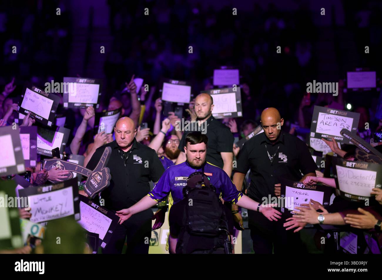 Luke Littler walking out before the quarter-final match against Stephen ...