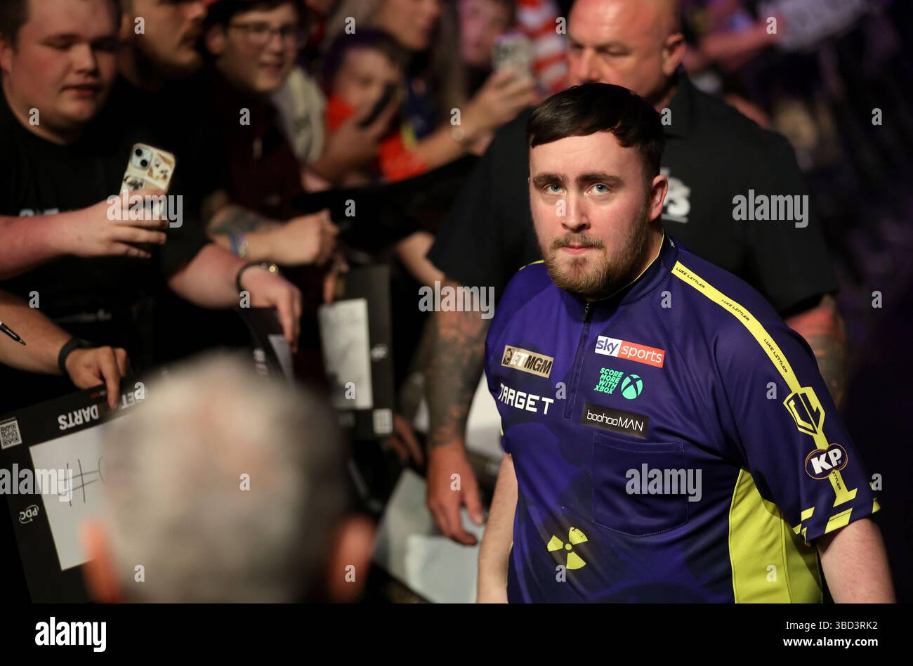 Luke Littler walking out before the quarter-final match against Stephen ...
