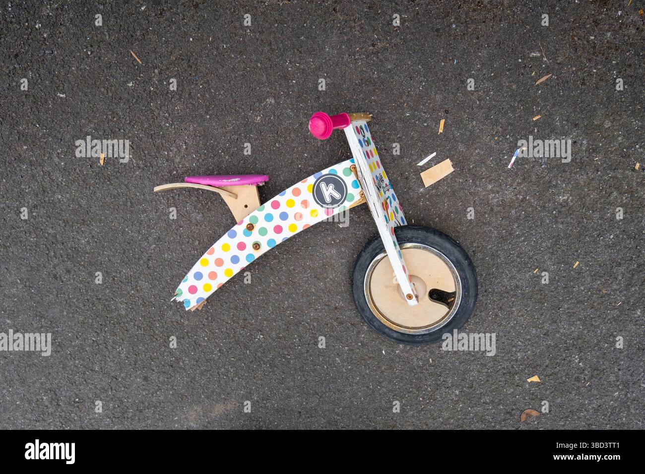 Broken wooden child bike with a missing wheel Stock Photo - Alamy