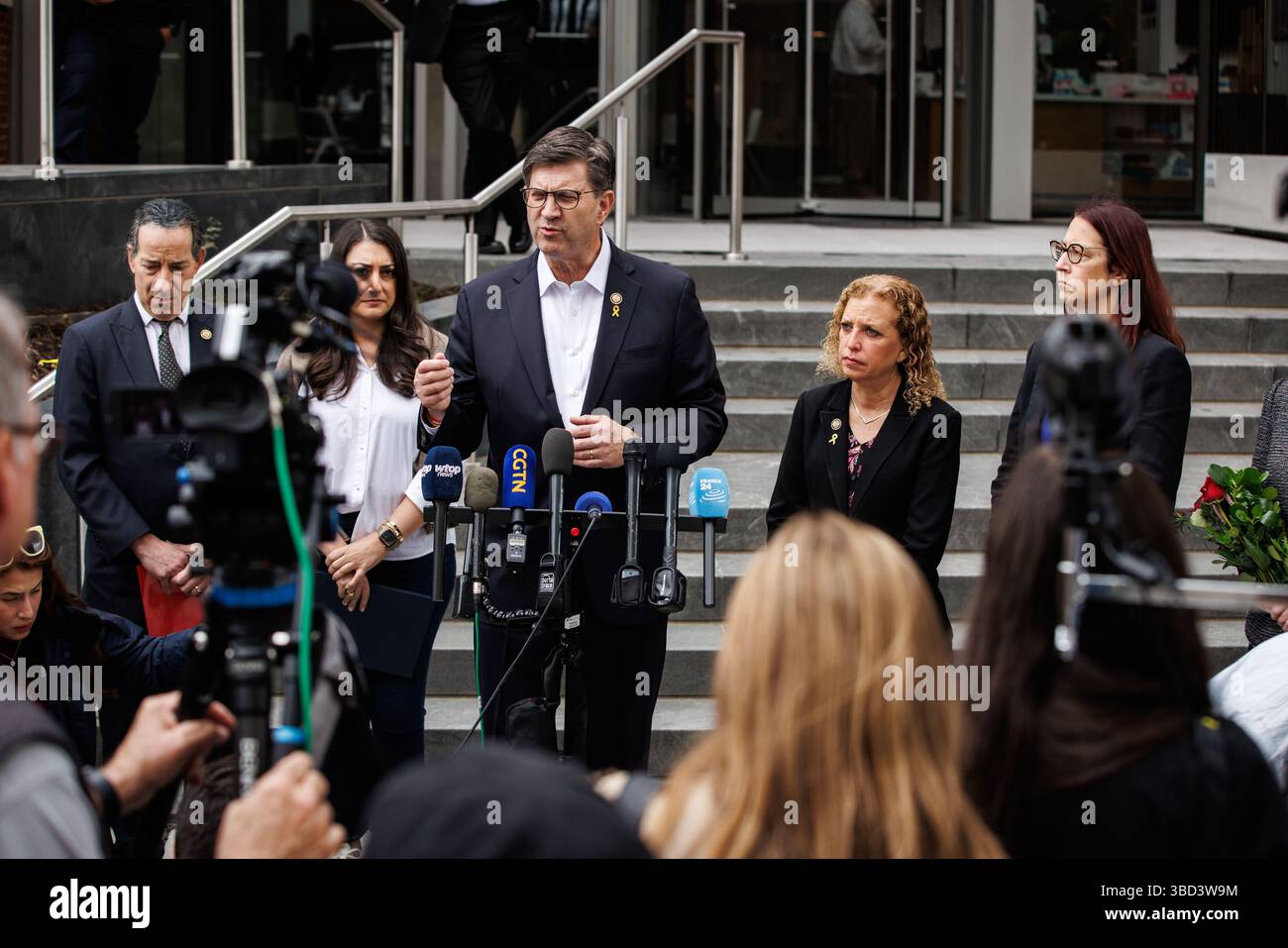 Rep. Brad Schneider (D-IL) speaks alongside (left to right ...