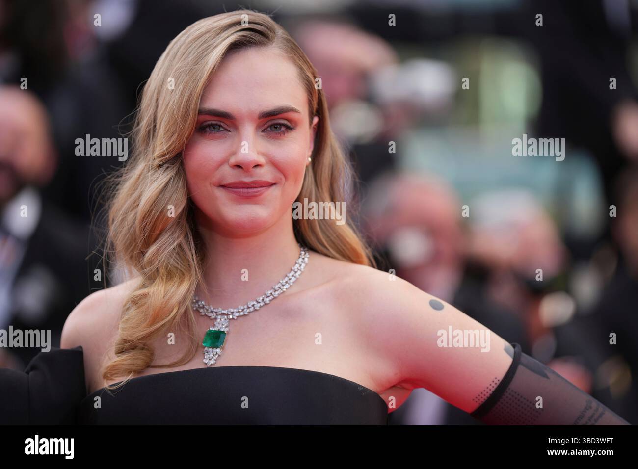 Cara Delevingne poses for photographers upon arrival at the premiere of ...