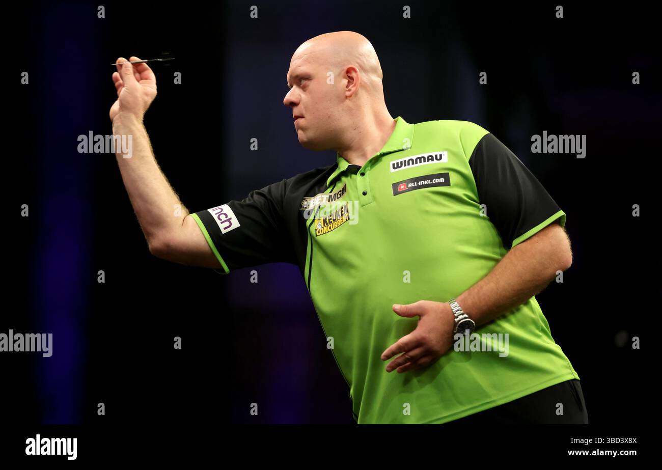 Michael van Gerwen in action against Nathan Aspinall in their quarter ...