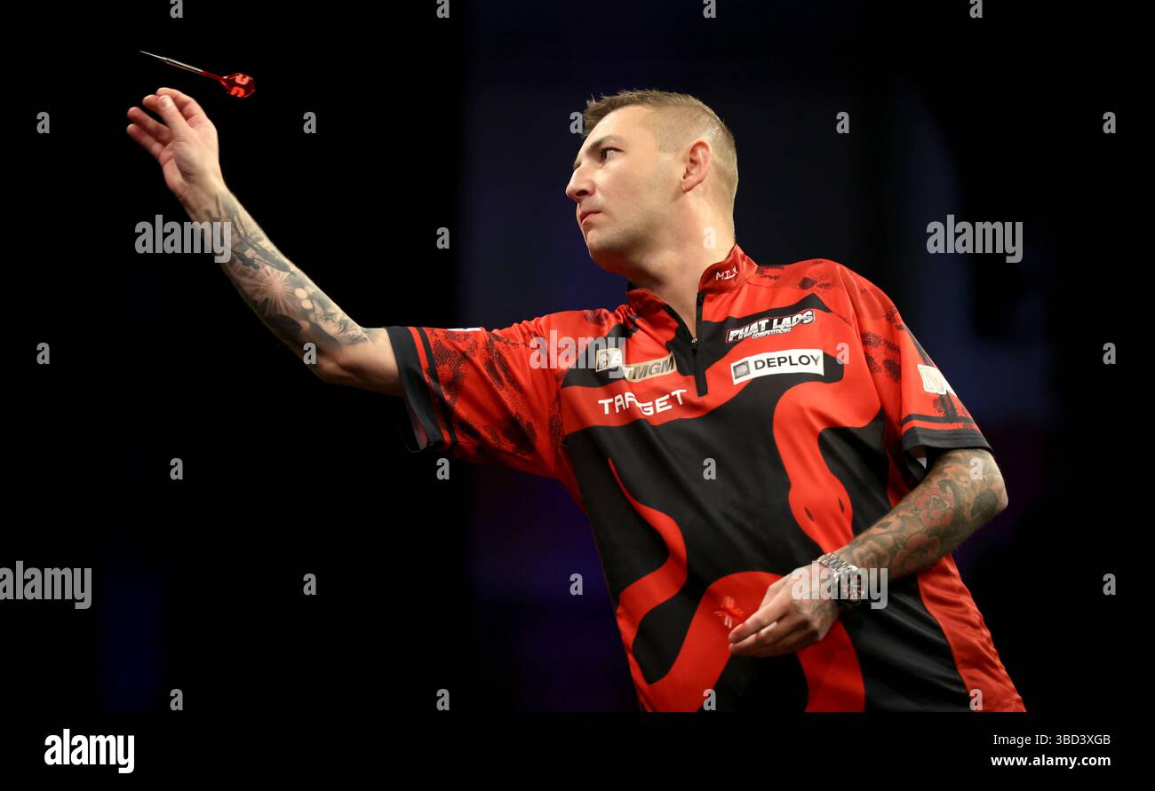 Nathan Aspinall in action against Michael van Gerwen in their quarter ...