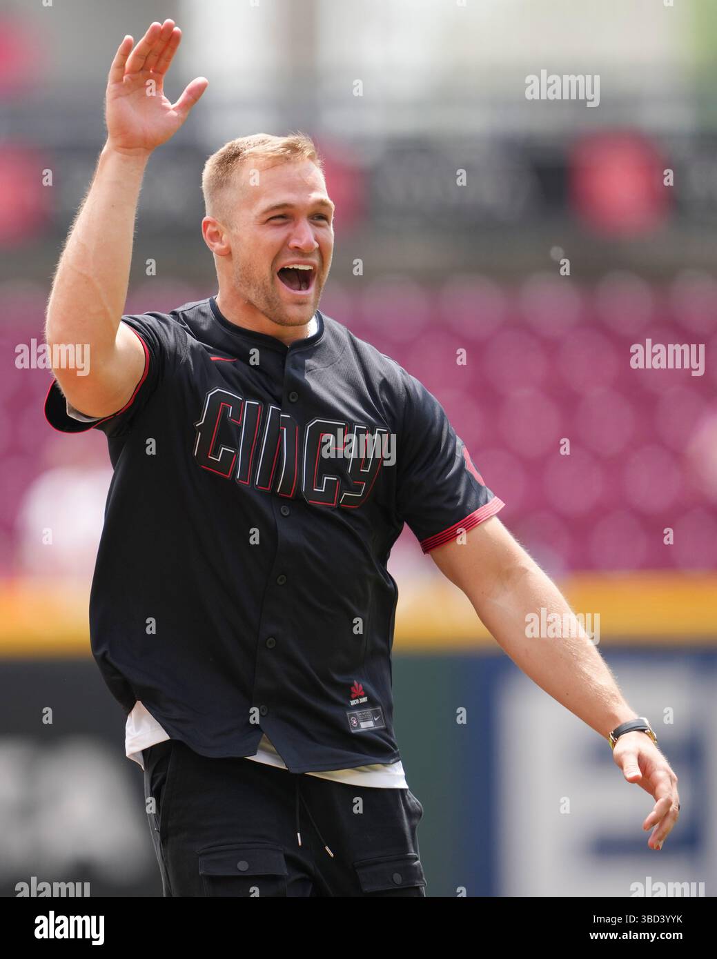 Cincinnati Bengals' Mike Gesicki reacts after throwing the first pitch ...