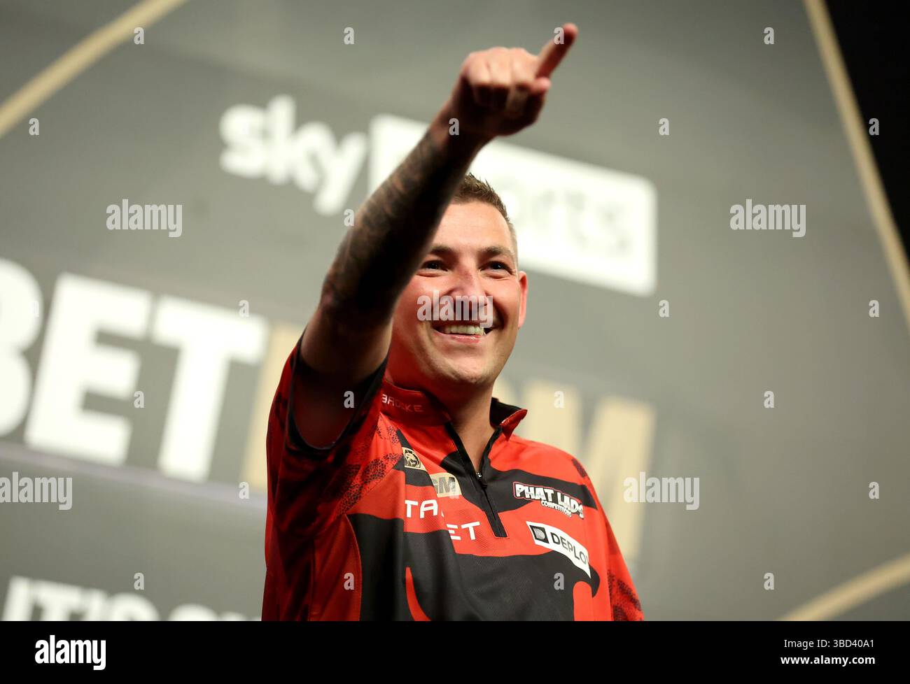 Nathan Aspinall celebrates victory against Michael van Gerwen in their ...