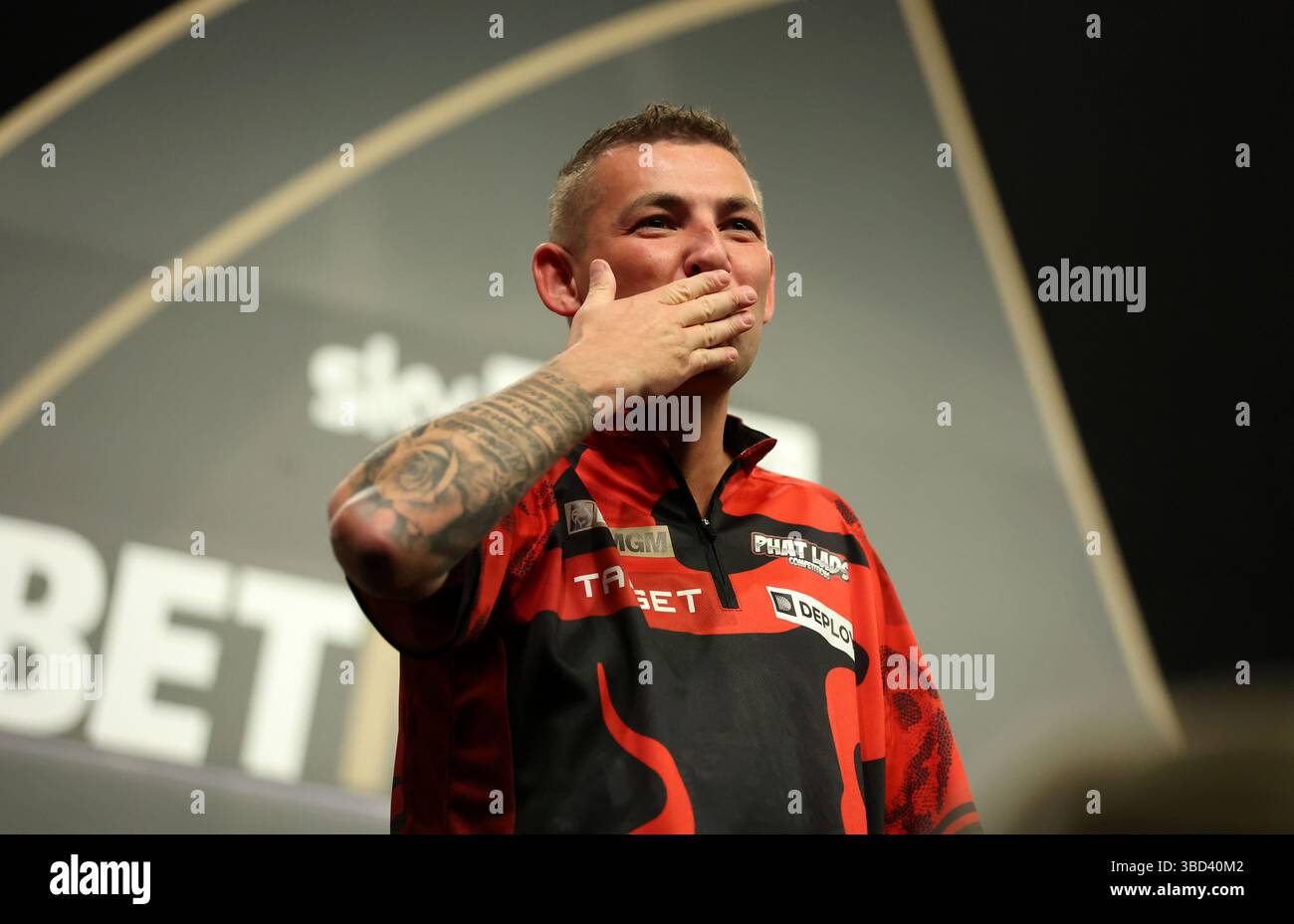 Nathan Aspinall celebrates victory against Michael van Gerwen in their ...