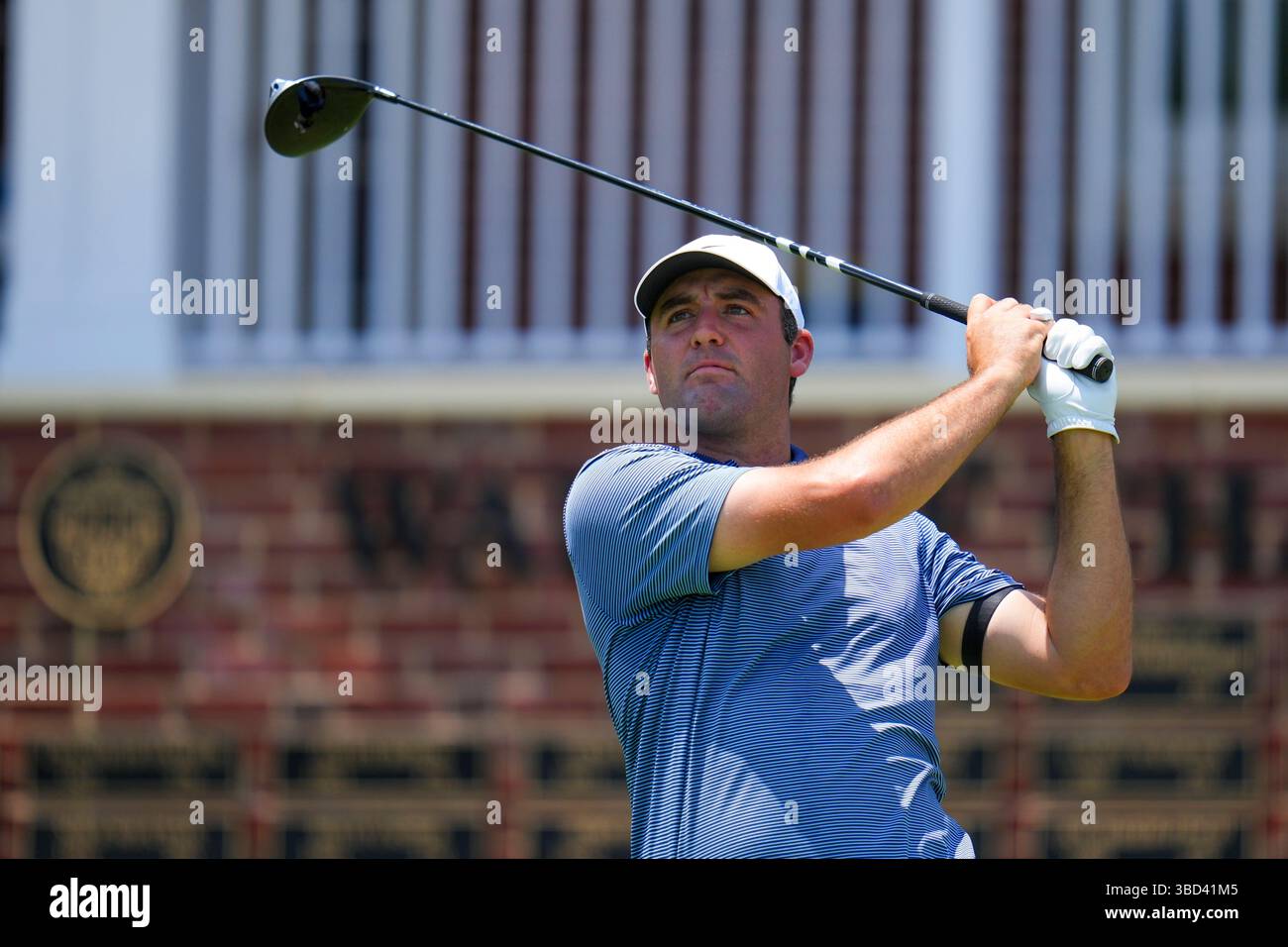 Scottie Scheffler watches his tee shot on the first hole during the ...