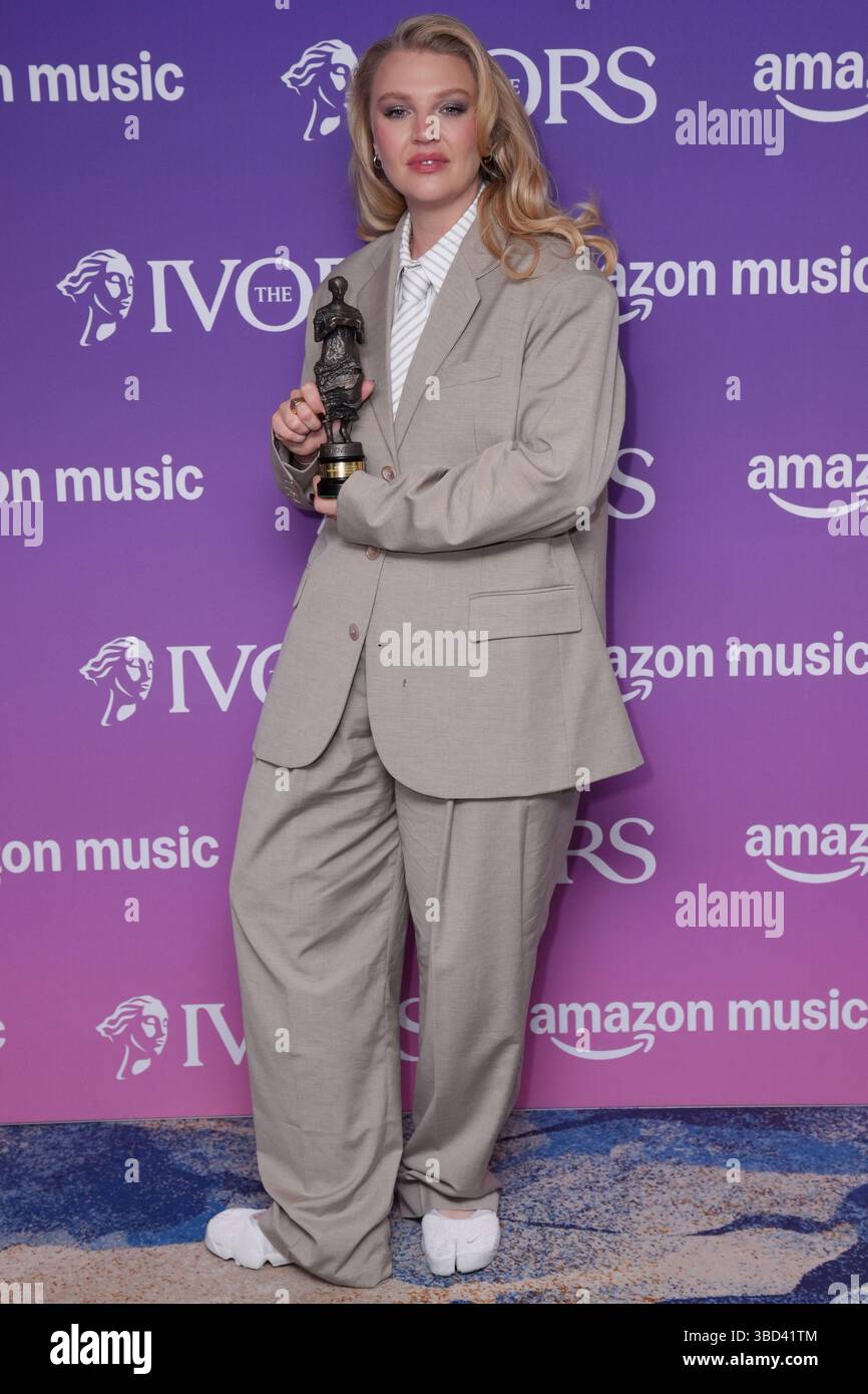 Self Esteem, winner of the Visionary Award, poses in the winners' room ...