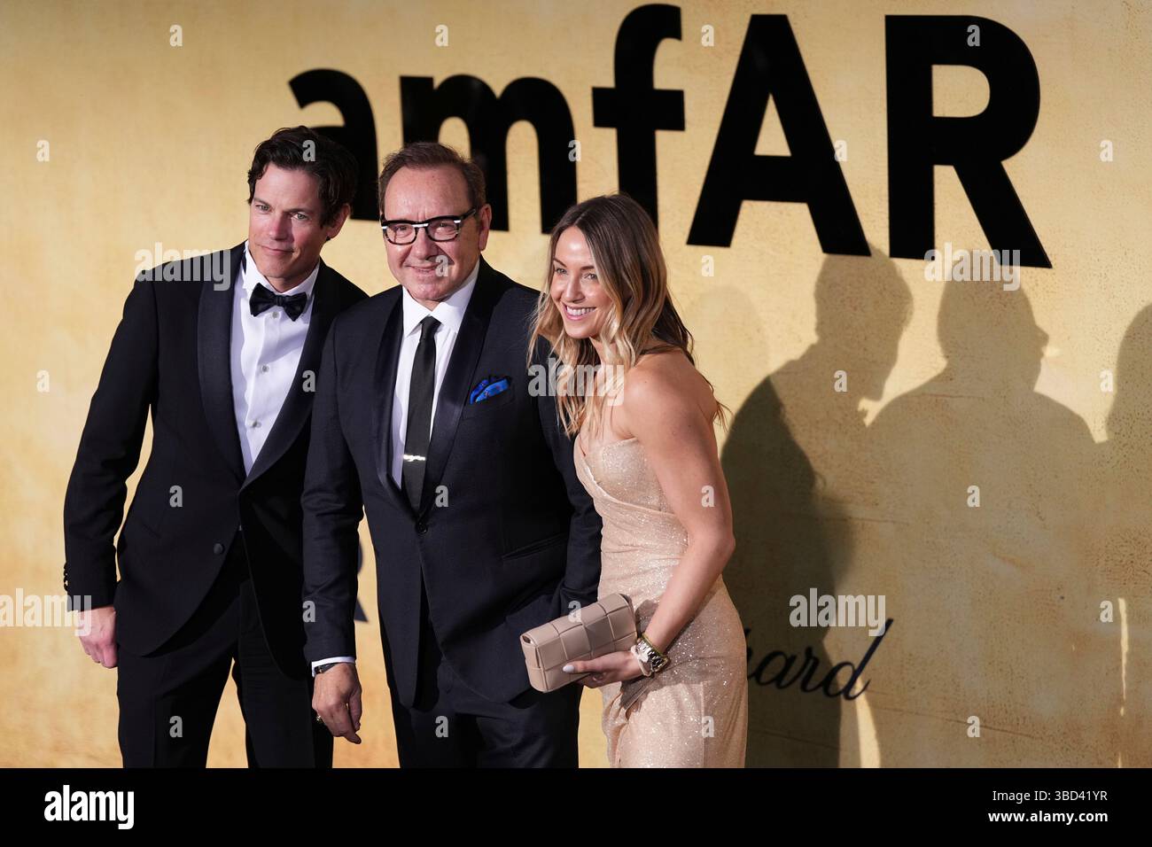 Jaron Lowenstein, left, and Kevin Spacey, center pose for photographers ...