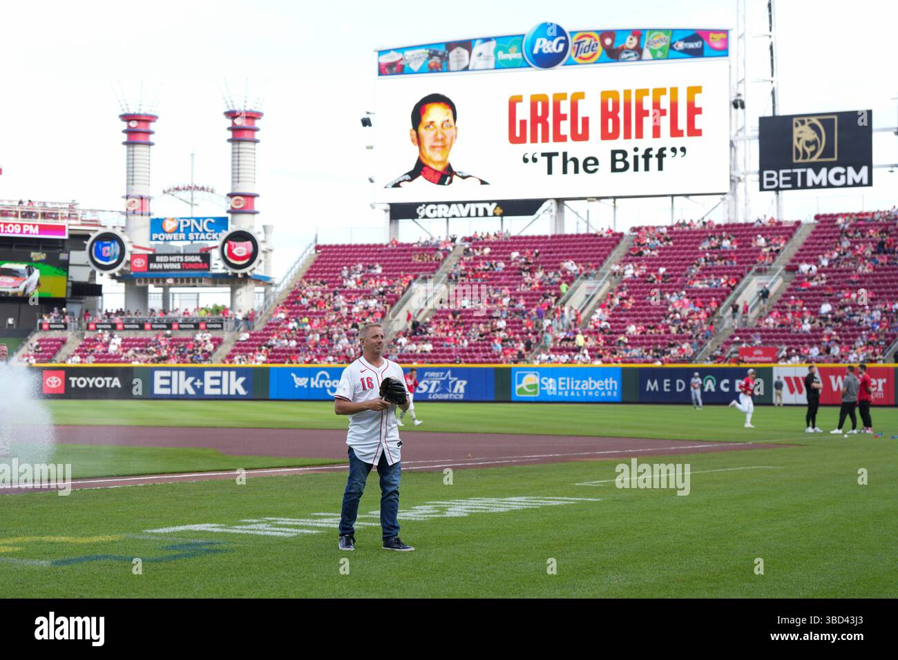 NASCAR driver Greg Biffle looks on prior to a baseball game between the ...