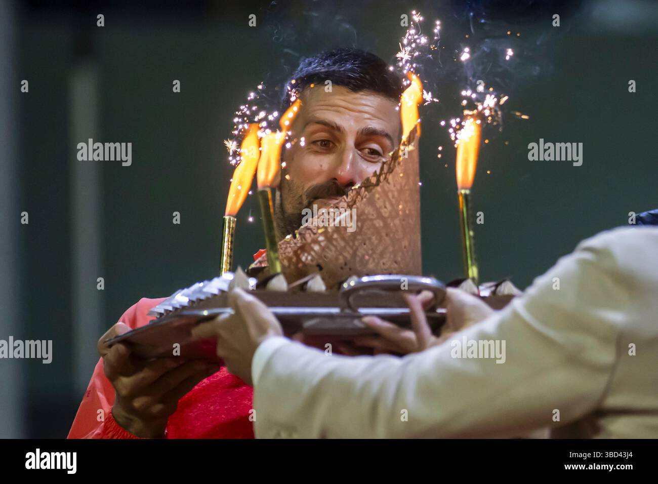 Serbian Novak Djokovic receives his birthday cake after defeating ...