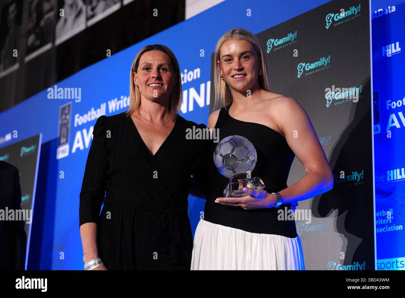 Kelly Smith (left) presents Alessia Russo with her trophy for FWA Women ...