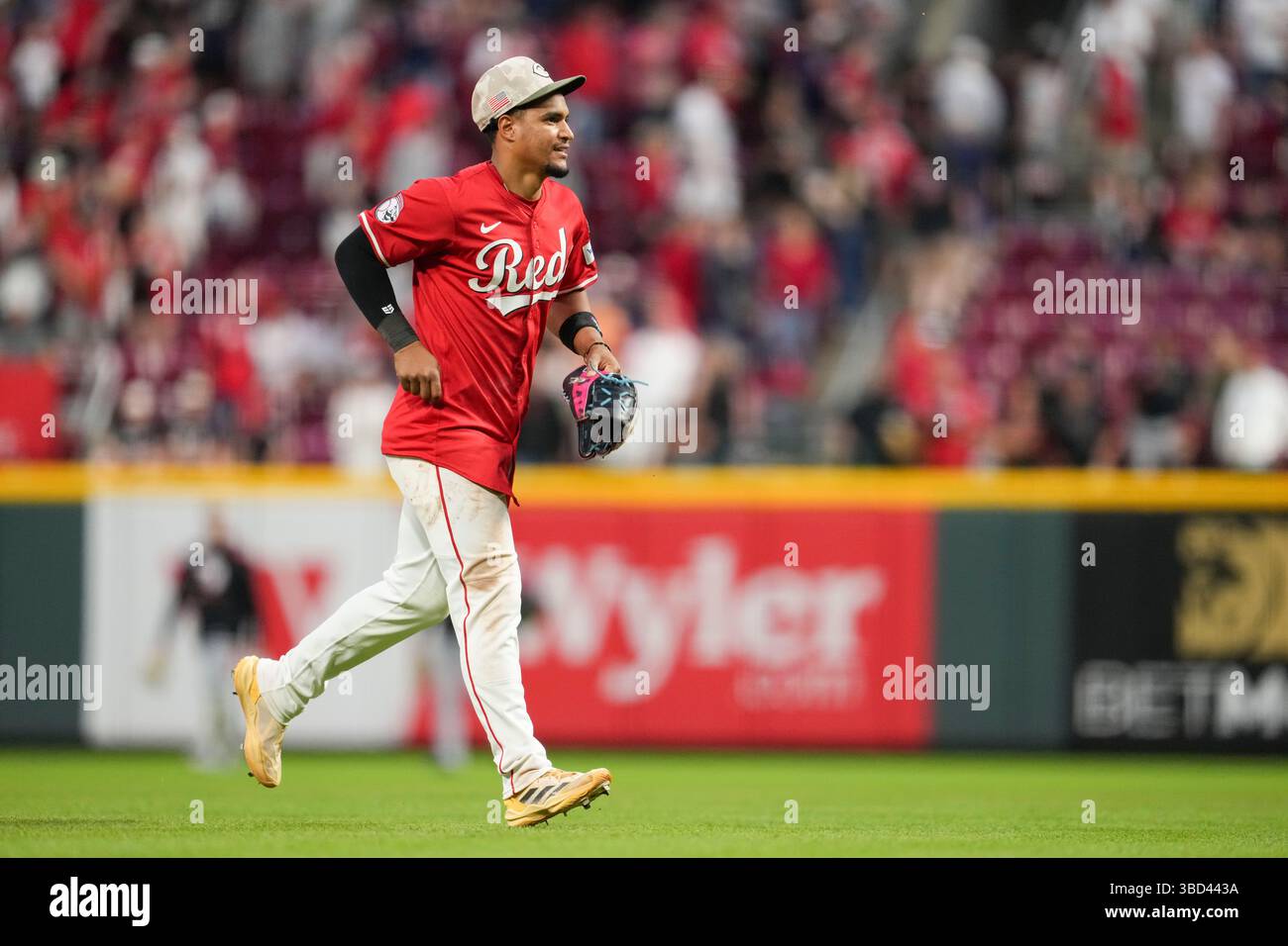 Cincinnati Reds' Santiago Espinal jogs off the field following a ...