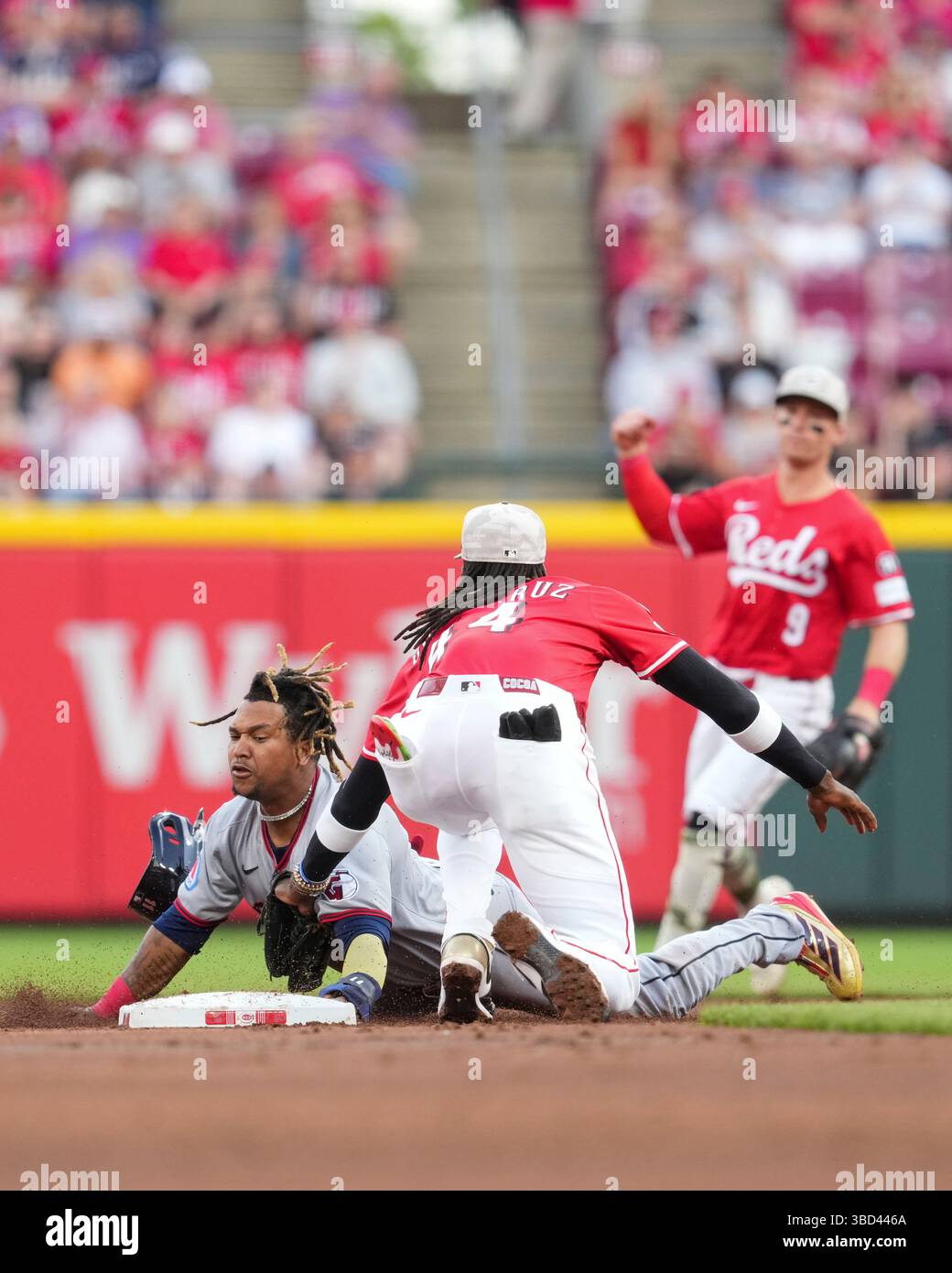 Cleveland Guardians' José Ramírez, left, is caught stealing second base by Cincinnati Reds ...